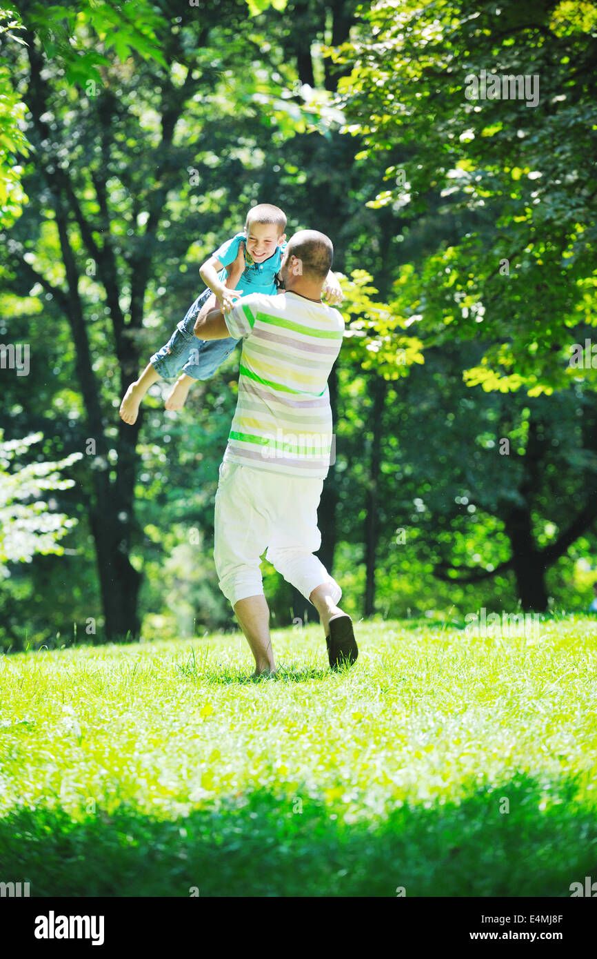 happy father and son have fun at park Stock Photo - Alamy
