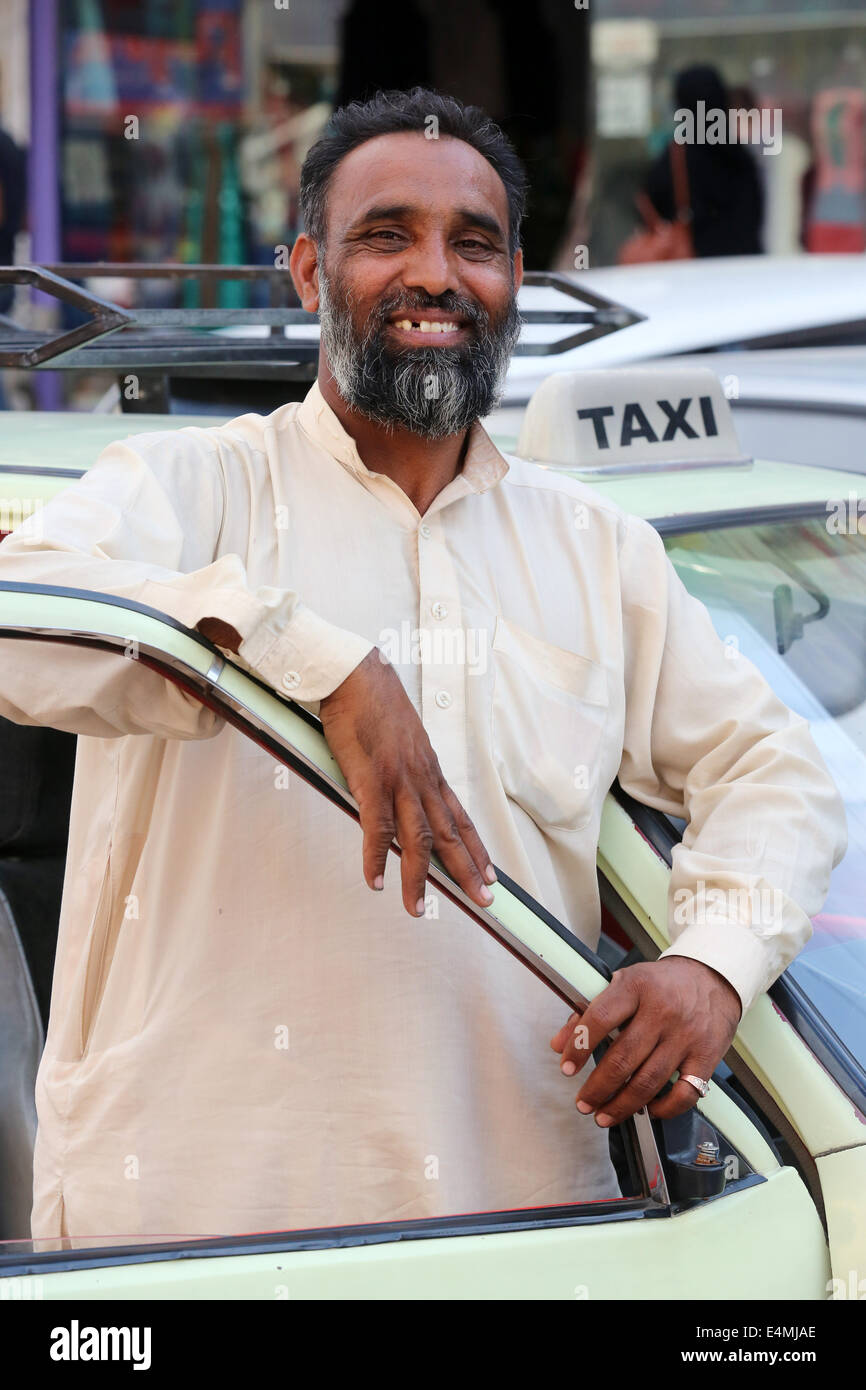 friendly taxi driver and his cab in Rawalpindi, Pakistan Stock Photo ...