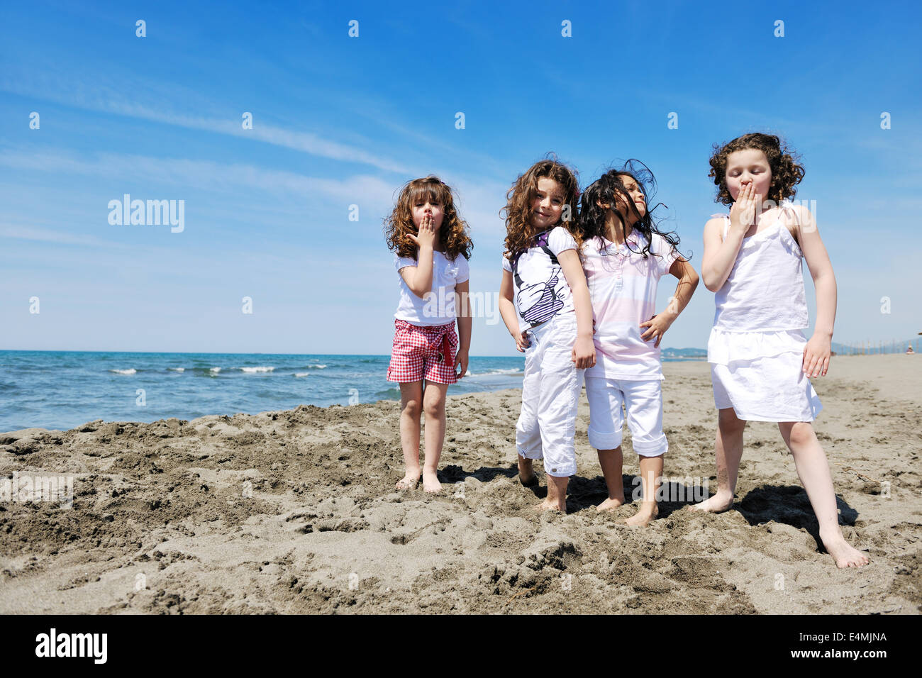 kids playing on beach Stock Photo - Alamy