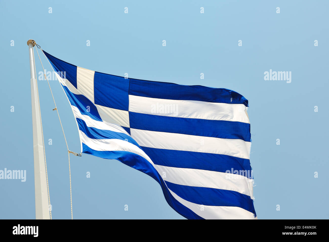 Old windmill waving flag hi-res stock photography and images - Alamy