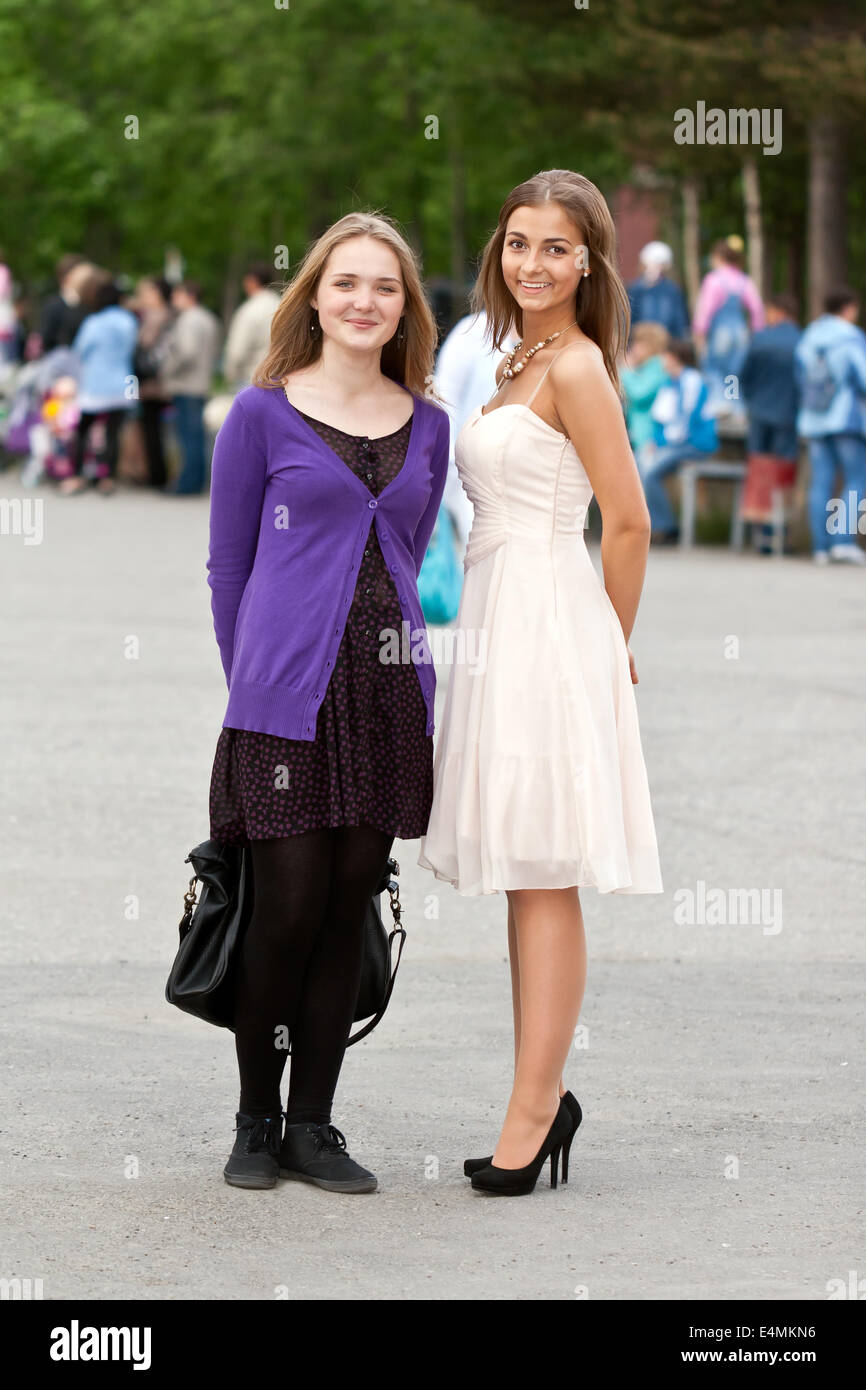Two girls in a square Stock Photo - Alamy