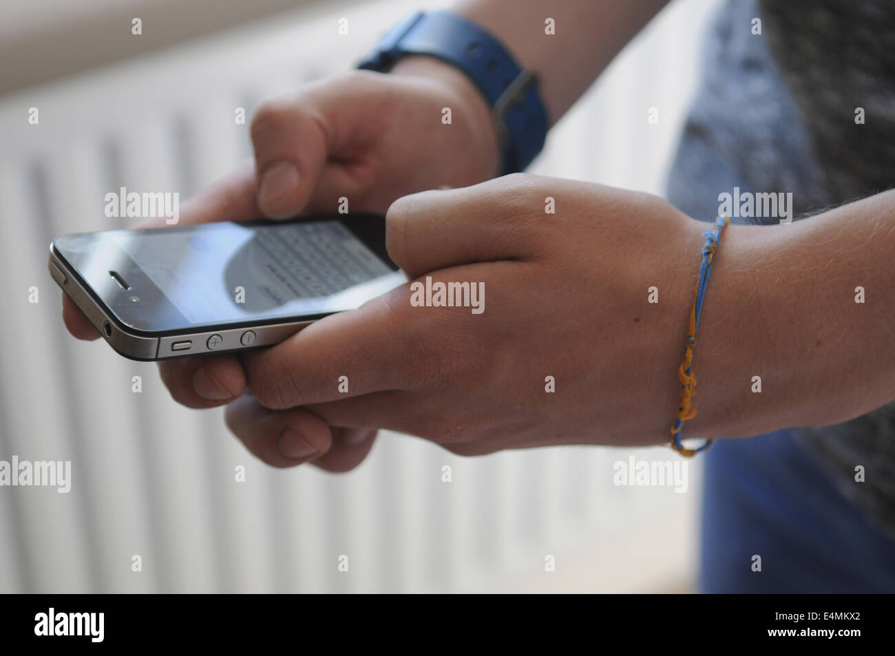 Boy Texting Iphone High Resolution Stock Photography and Images - Alamy