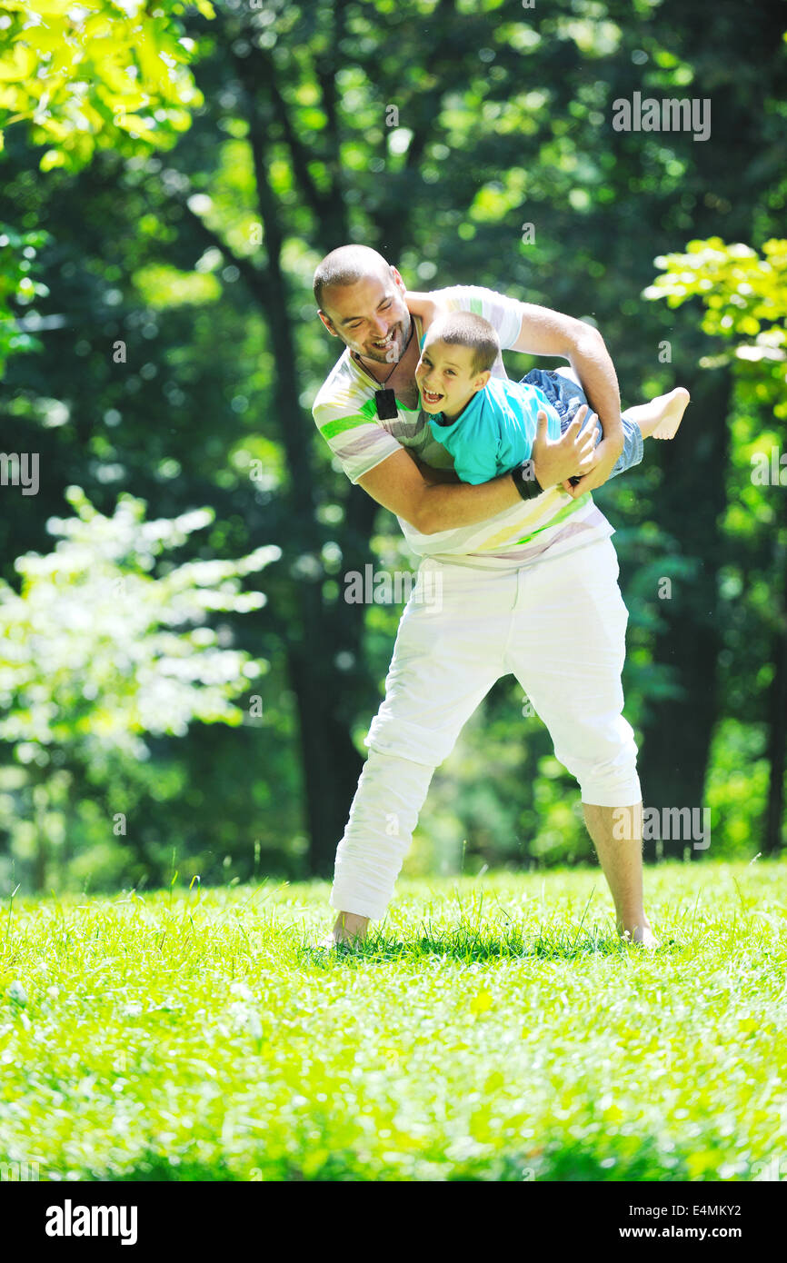happy father and son have fun at park Stock Photo - Alamy