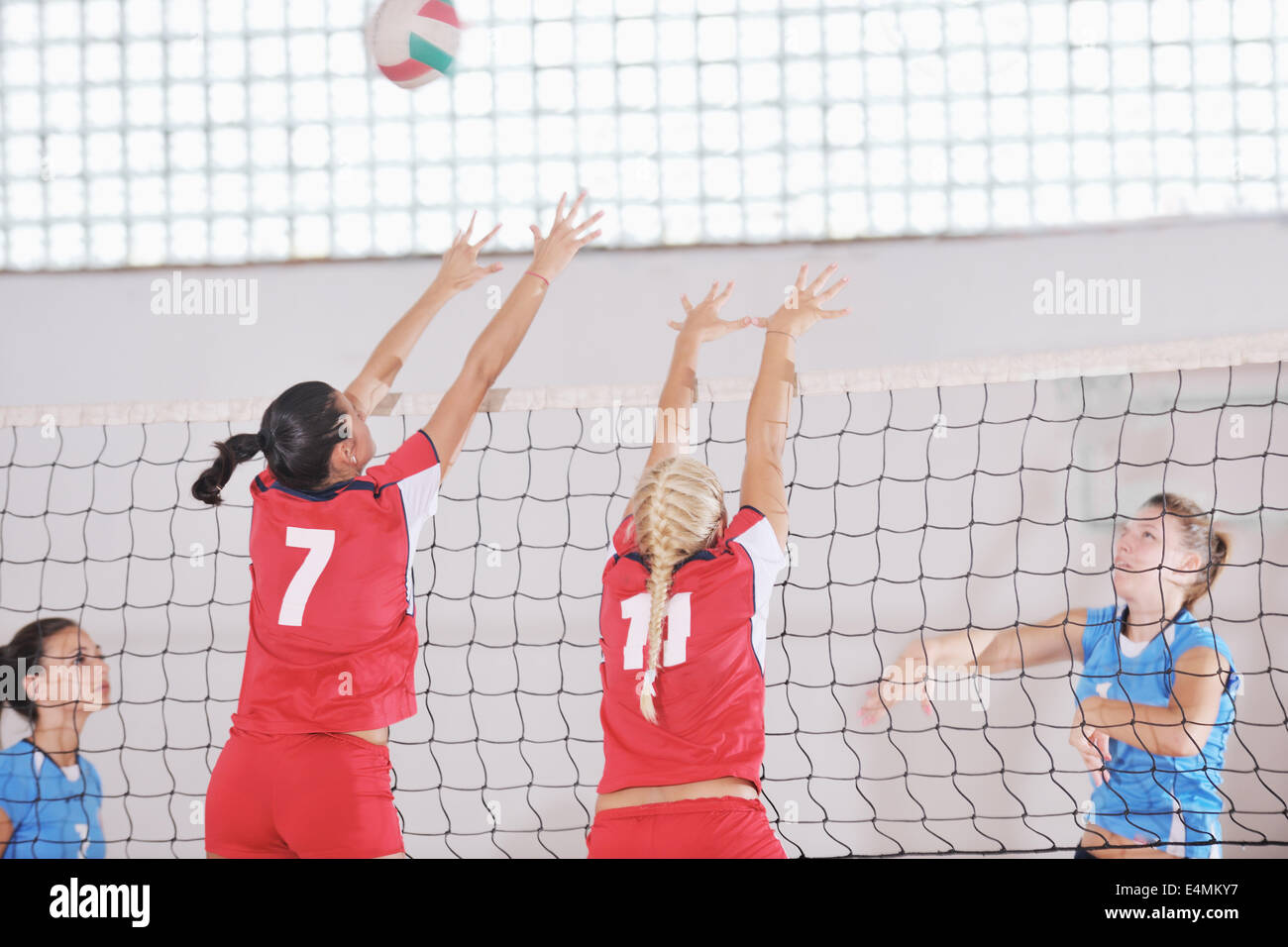 girls playing volleyball indoor game Stock Photo - Alamy