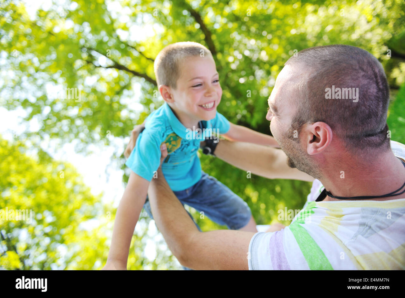 happy father and son have fun at park Stock Photo - Alamy