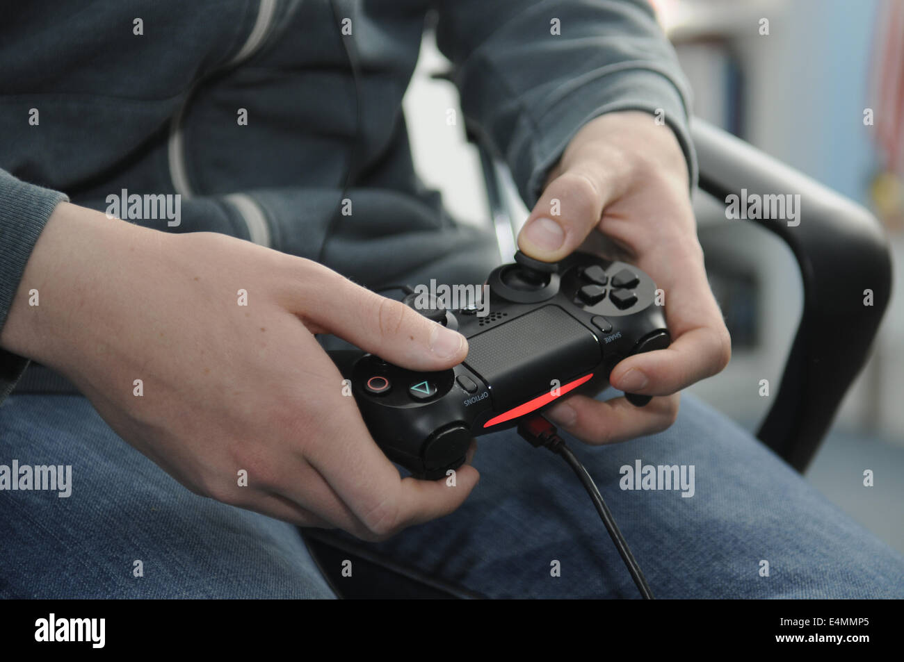 Close up of a teenage boy playing a computer game Stock Photo - Alamy