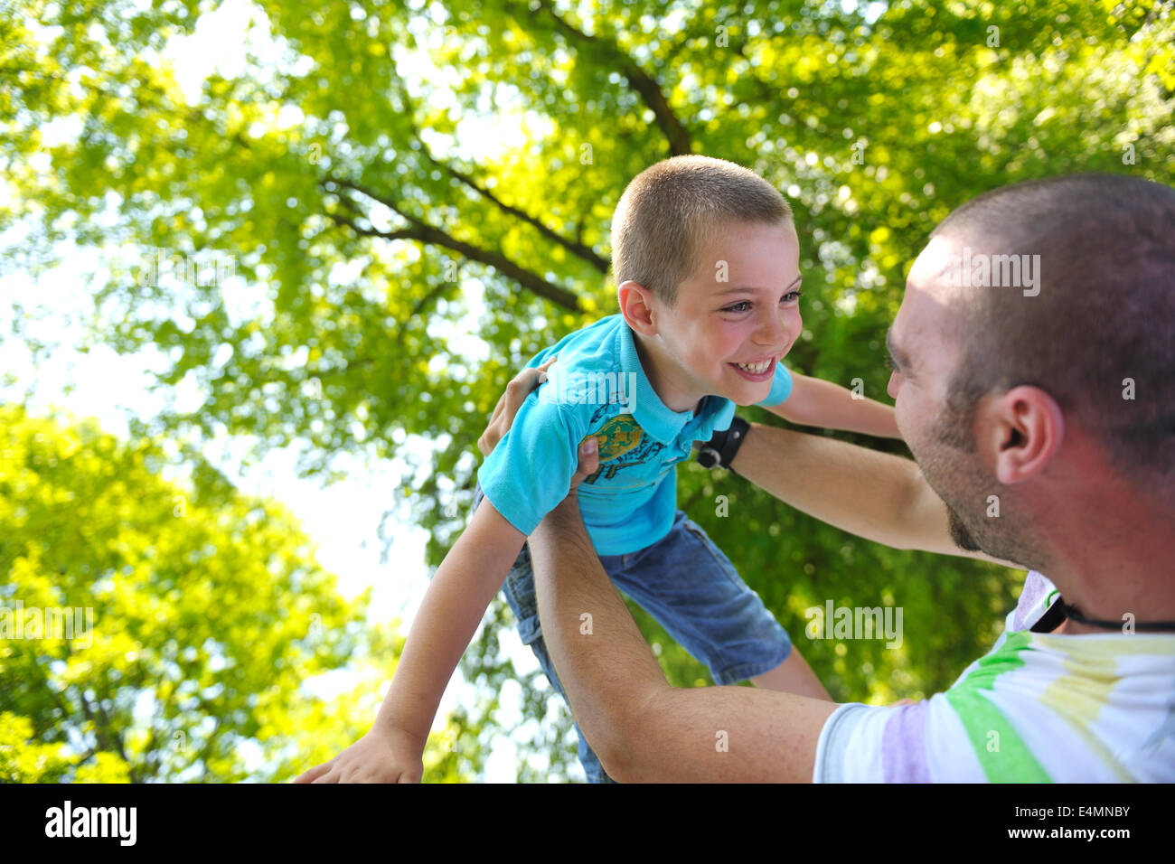 happy father and son have fun at park Stock Photo - Alamy