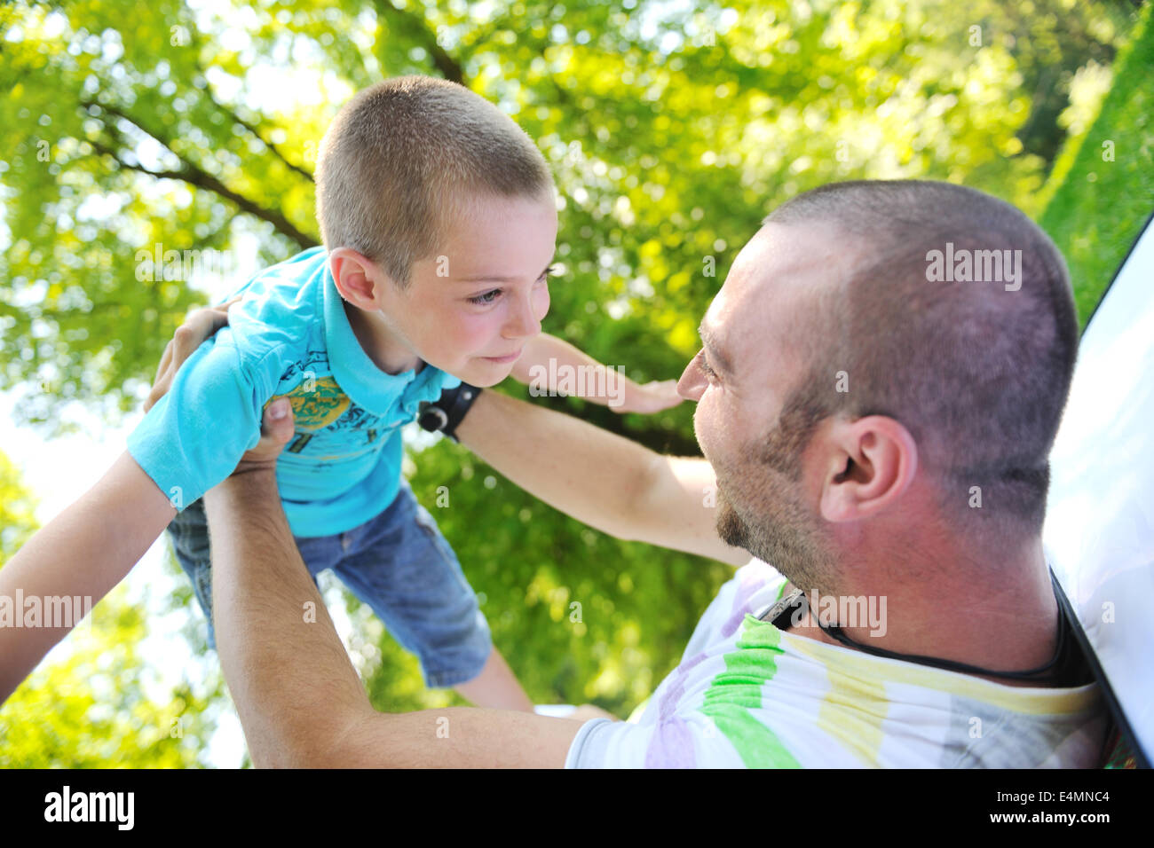 happy father and son have fun at park Stock Photo - Alamy