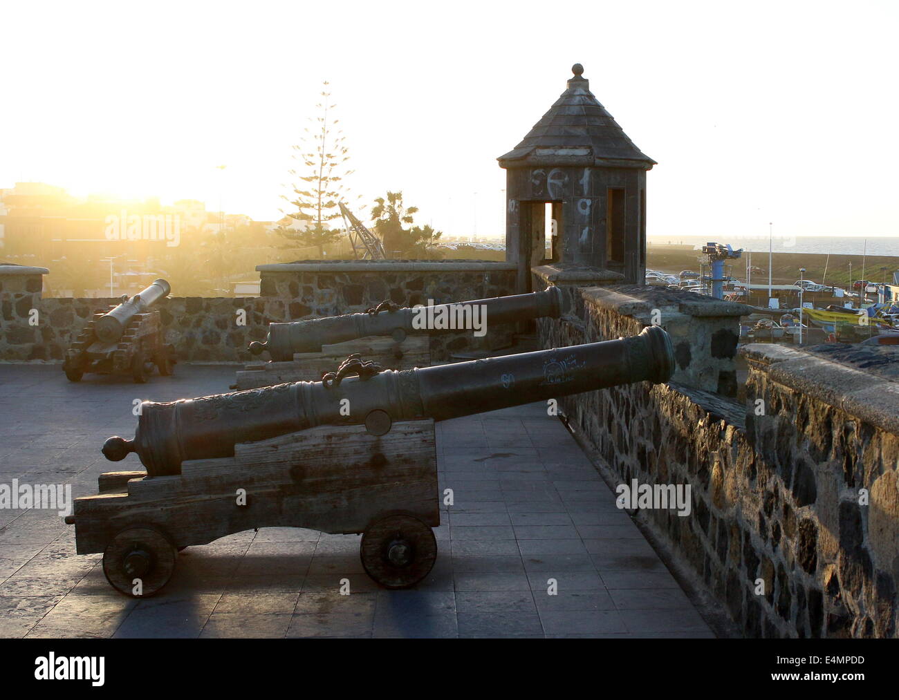 Old ramparts and cannons at the harbour on the Atlantic Ocean coast of ...