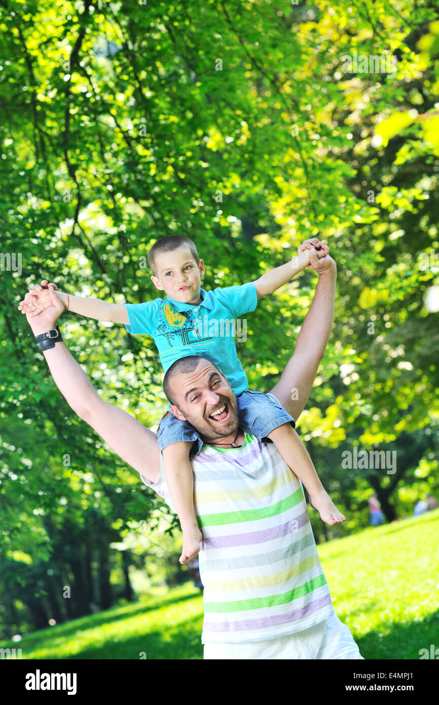 happy father and son have fun at park Stock Photo - Alamy