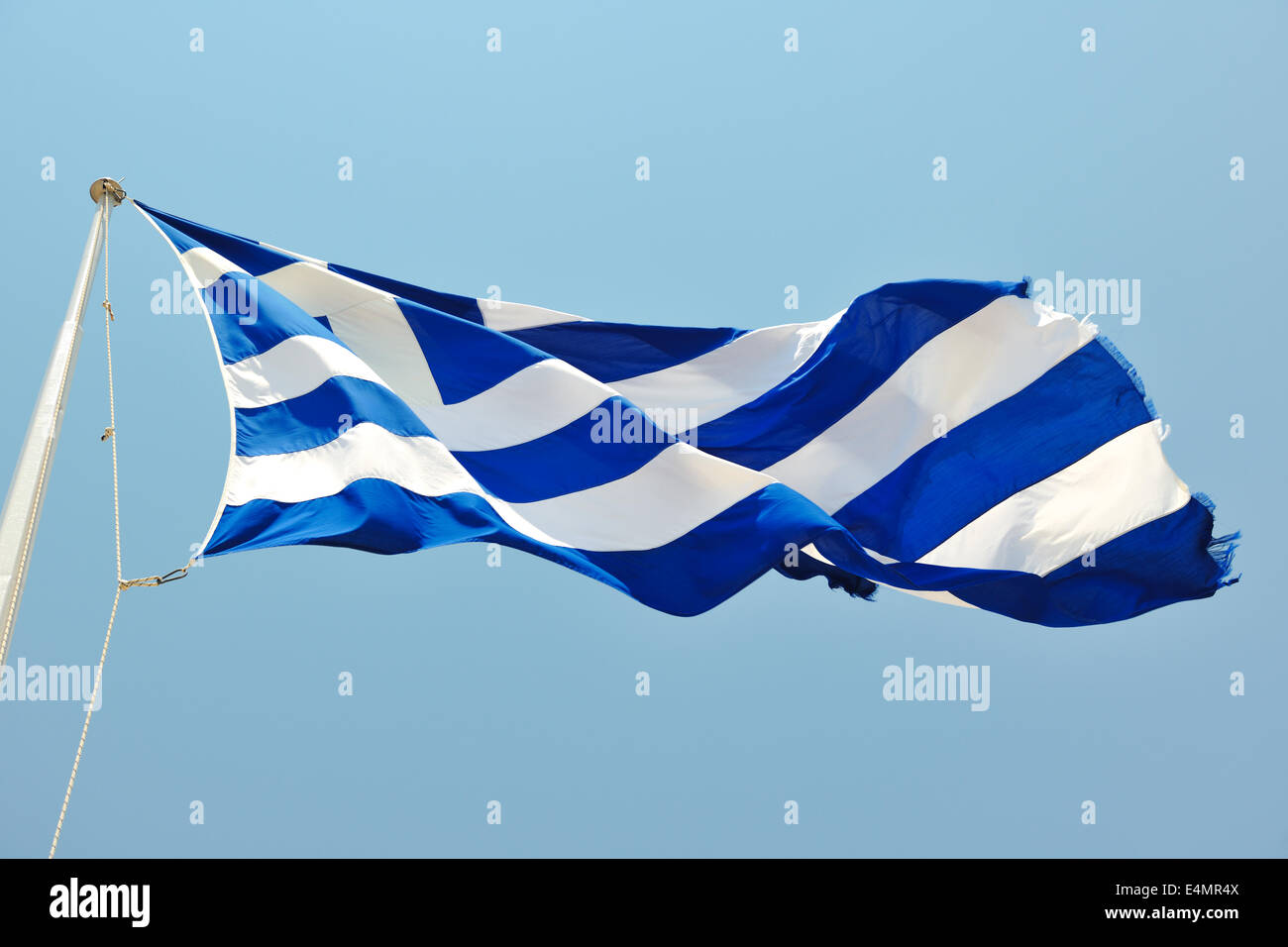 Old windmill waving flag hi-res stock photography and images - Alamy