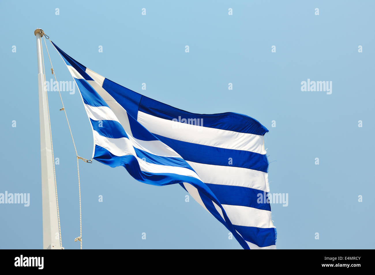 Old windmill waving flag hi-res stock photography and images - Alamy