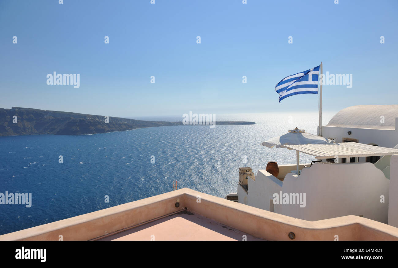 Old windmill waving flag hi-res stock photography and images - Alamy
