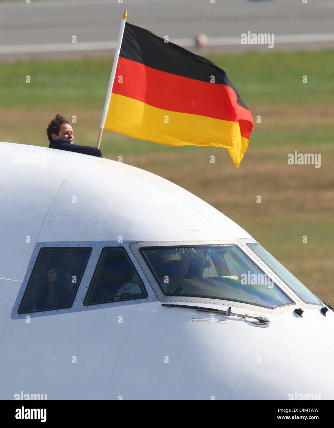 Berlin, Germany. 15th July, 2014. Flight captain Uwe Strohdeicher holds ...