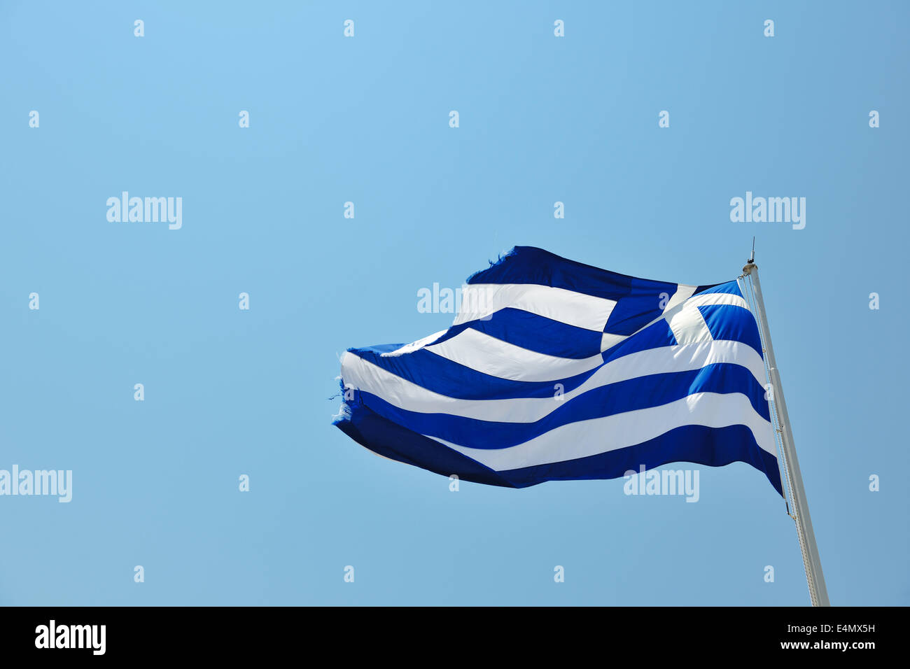 Old windmill waving flag hi-res stock photography and images - Alamy