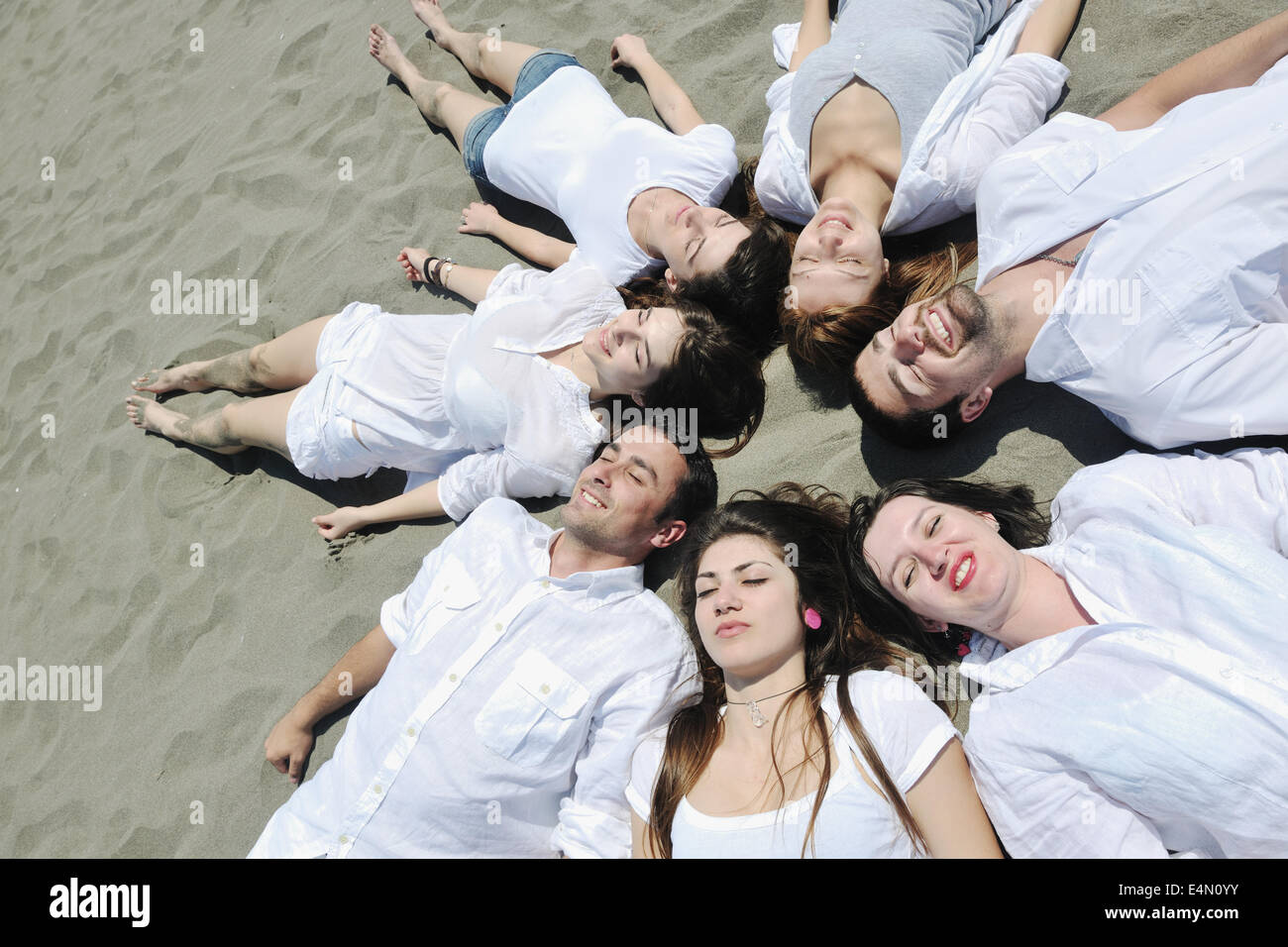 Group of happy young people in have fun at beach Stock Photo - Alamy