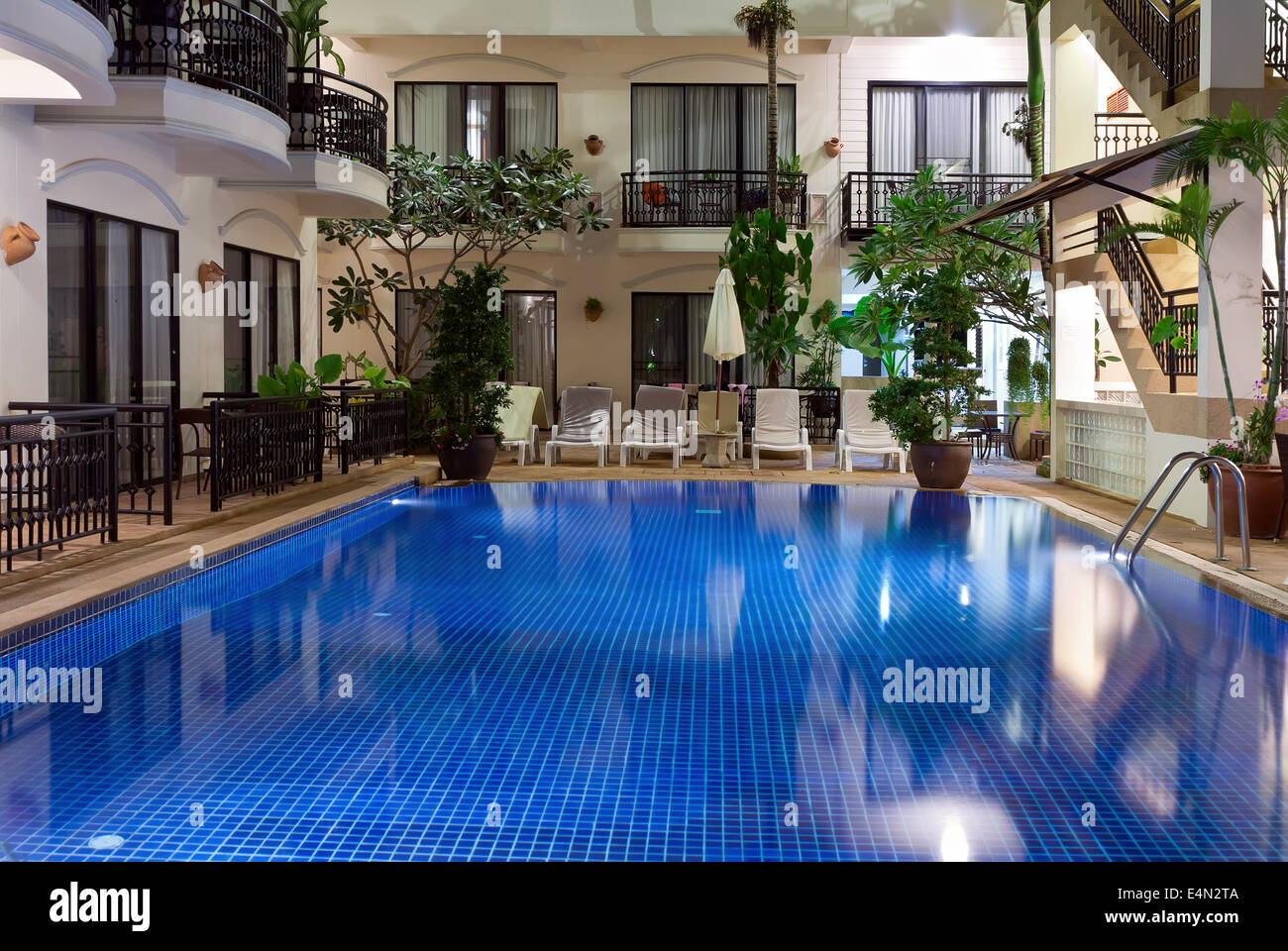 pool with blue water in a cozy hotel Stock Photo - Alamy