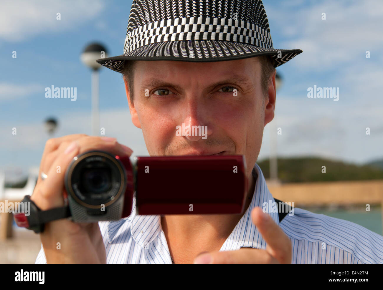man in a hat with a camera Stock Photo - Alamy