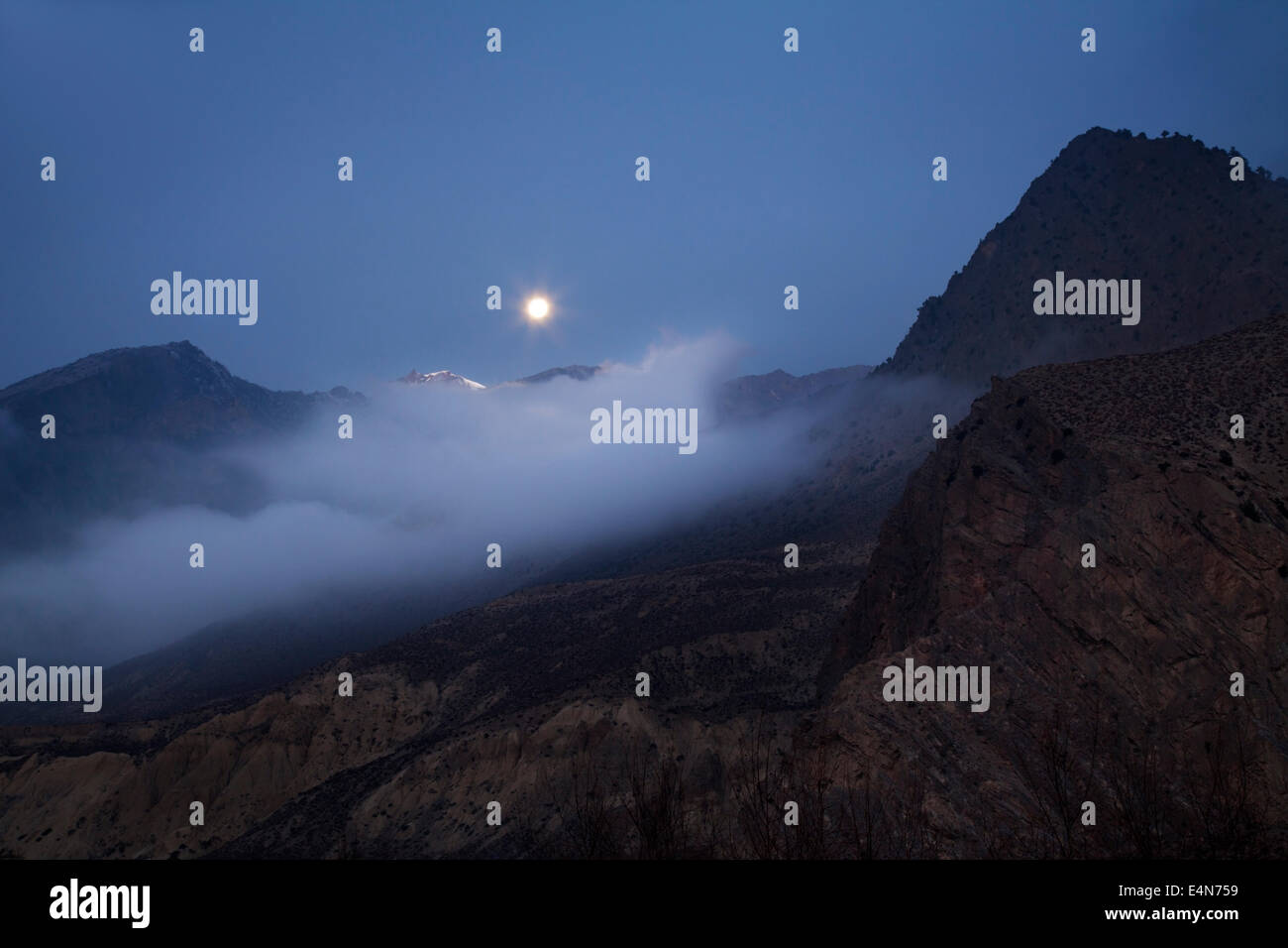 Moon and Mountains at Jomsom, Mustang District, Himalayas, Nepal Stock ...