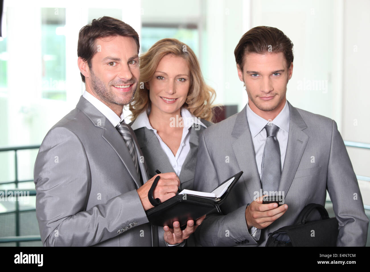 Business colleagues smiling Stock Photo - Alamy
