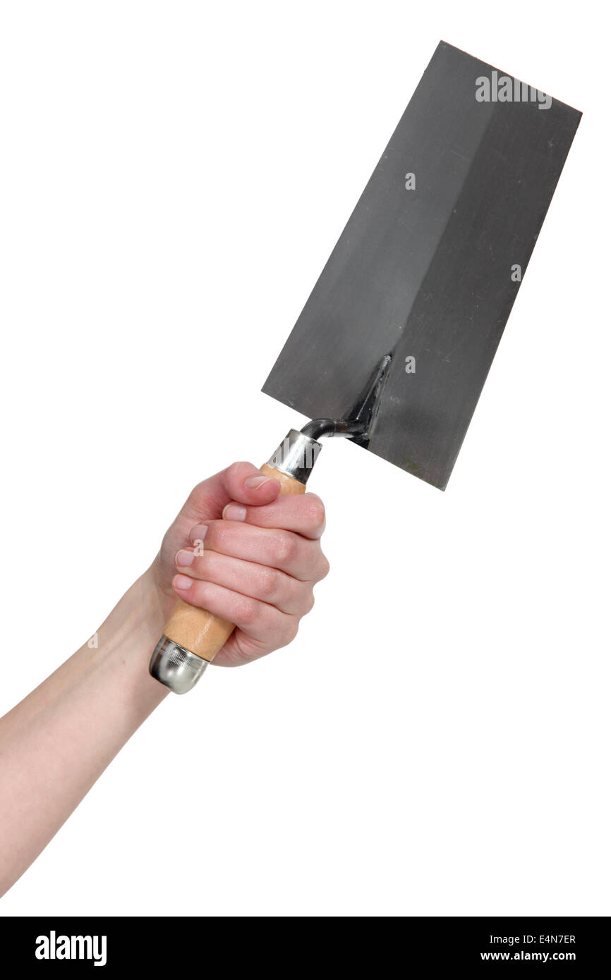Hand holding a bucket trowel Stock Photo - Alamy