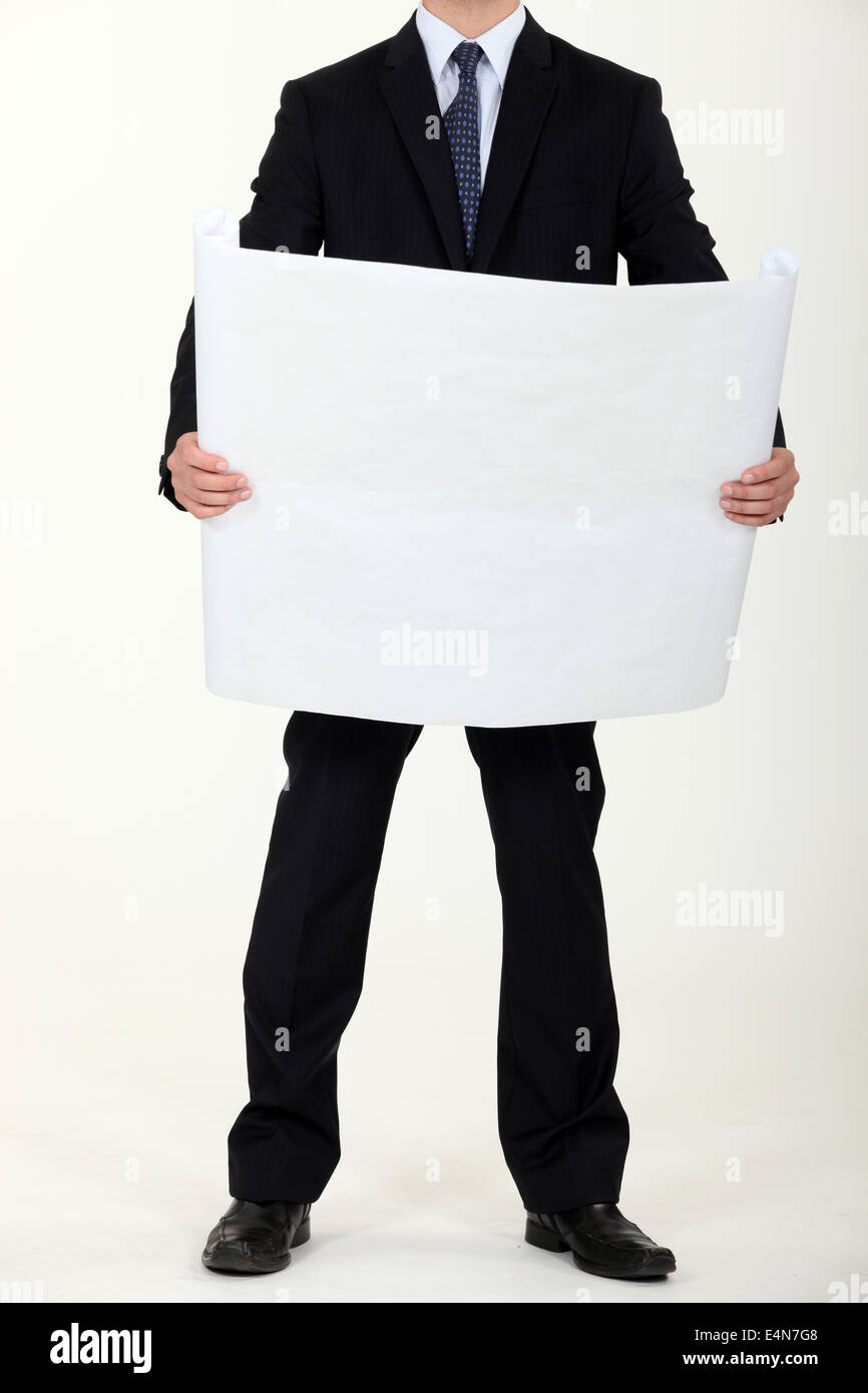 Man looking at a technical drawing Stock Photo - Alamy