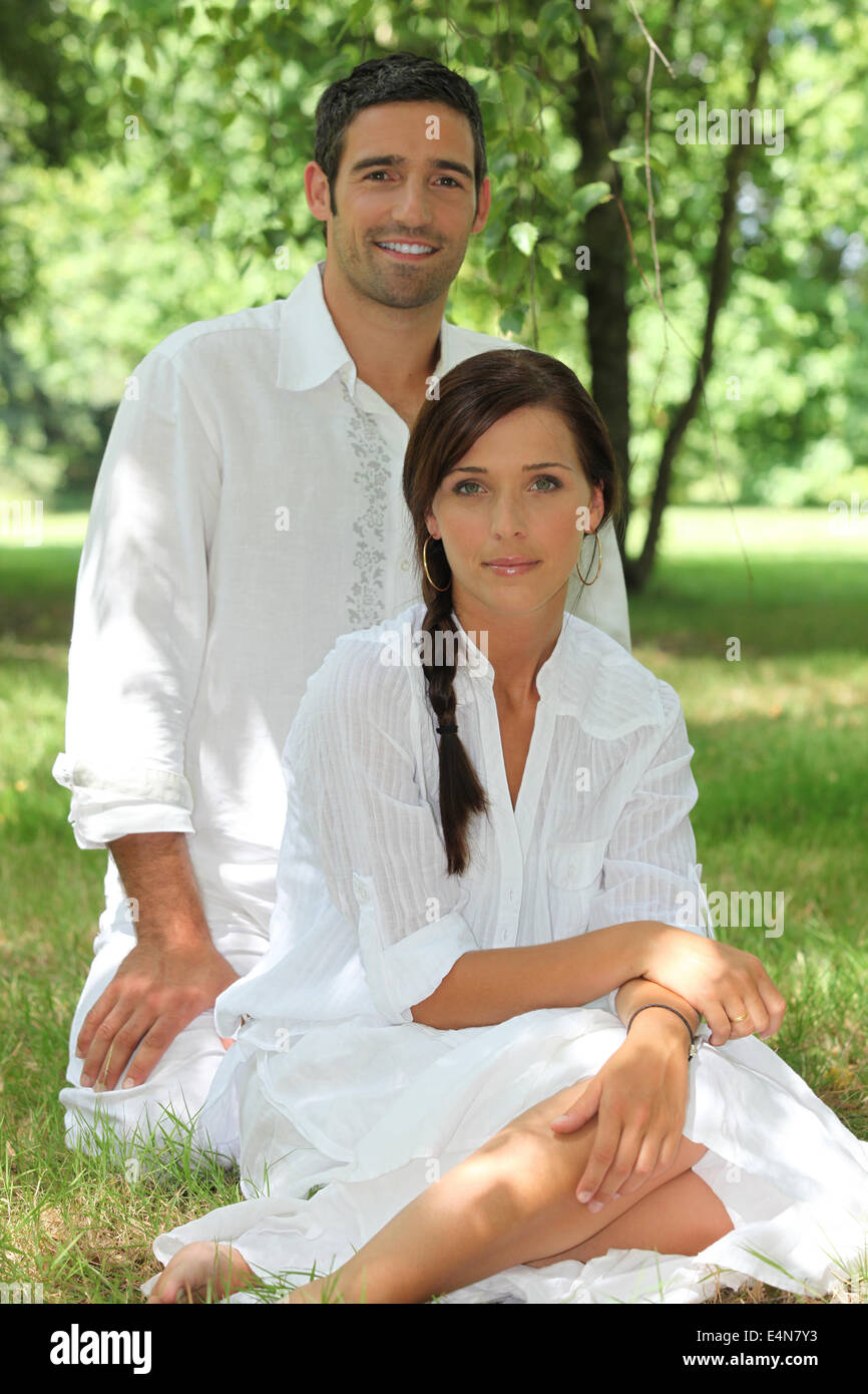 man and woman sitting in the forest Stock Photo - Alamy