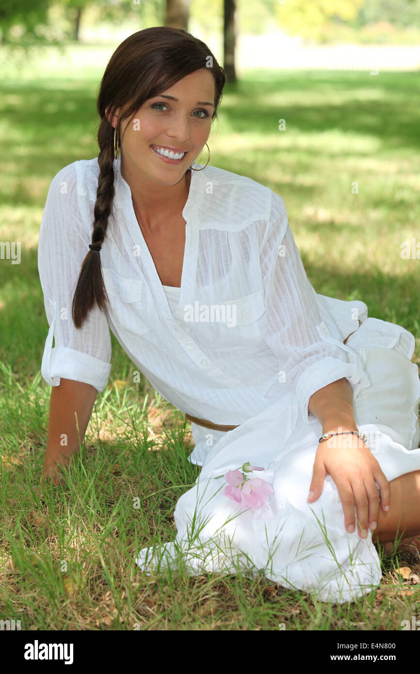 Attractive woman in a park Stock Photo - Alamy