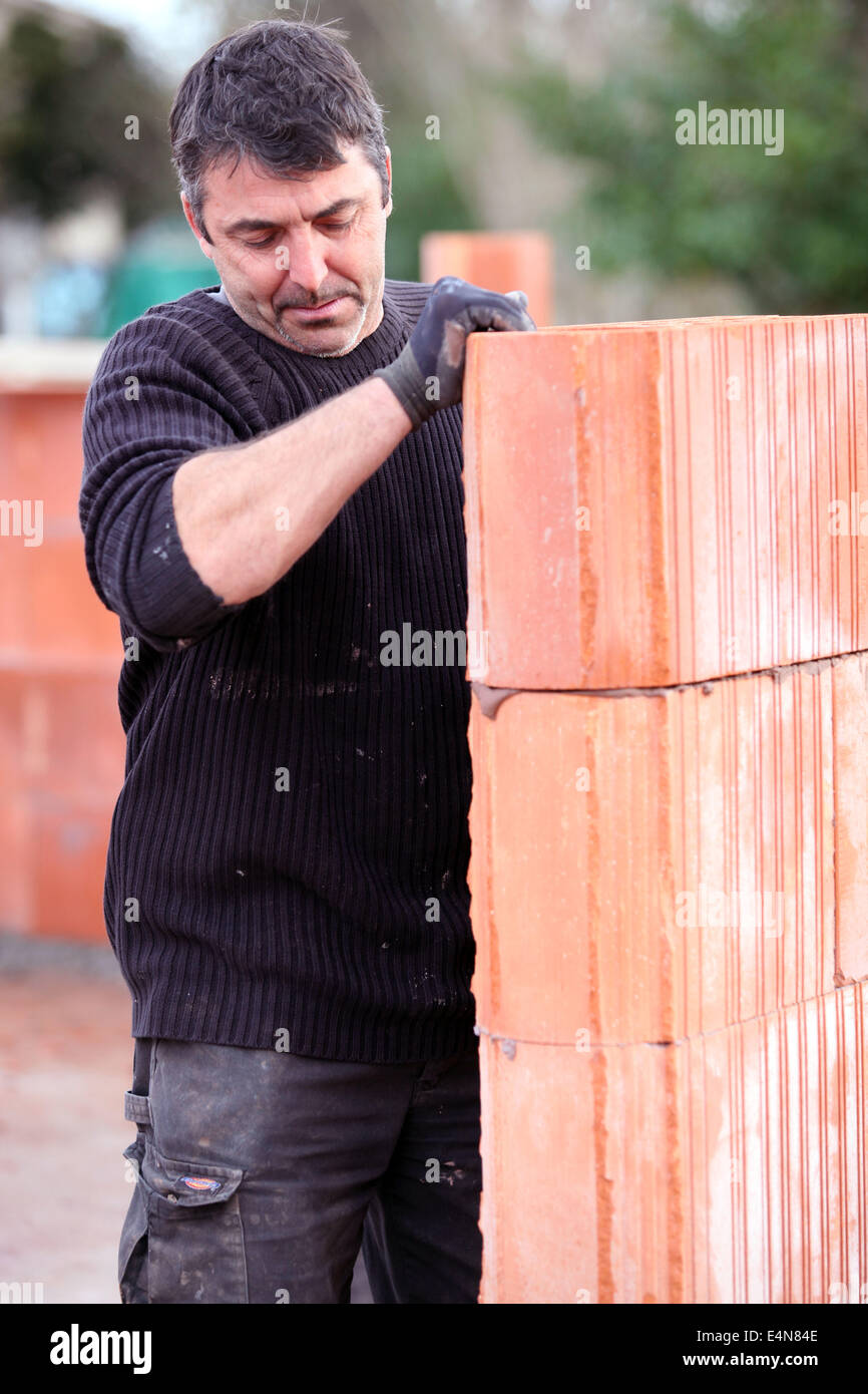 Mason labour working construction site hi-res stock photography and ...