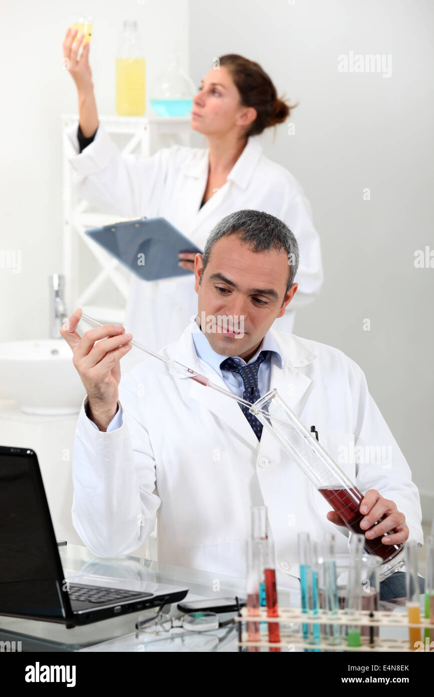 Scientists performing experiments Stock Photo - Alamy