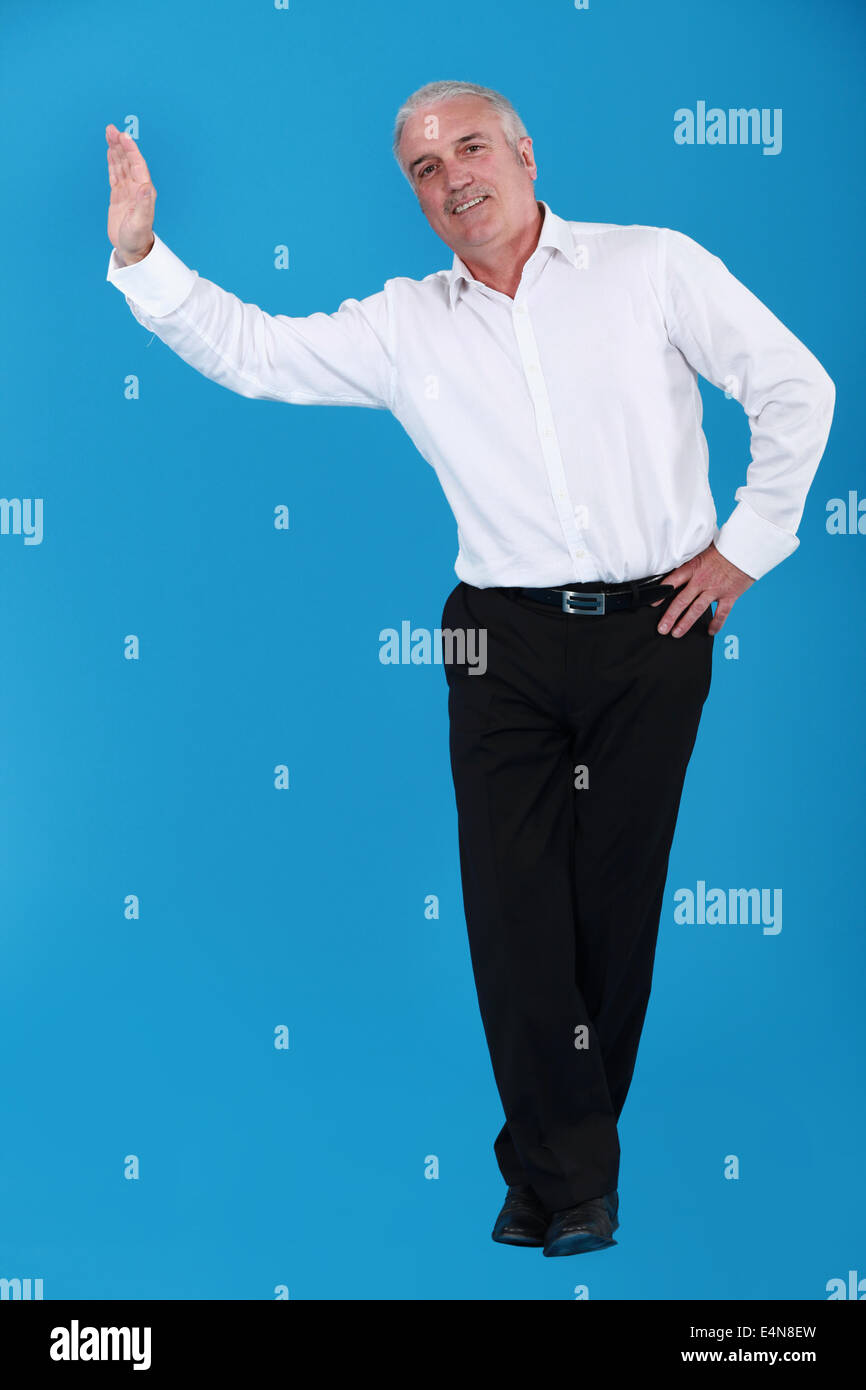 Man pretending to lean against wall Stock Photo - Alamy