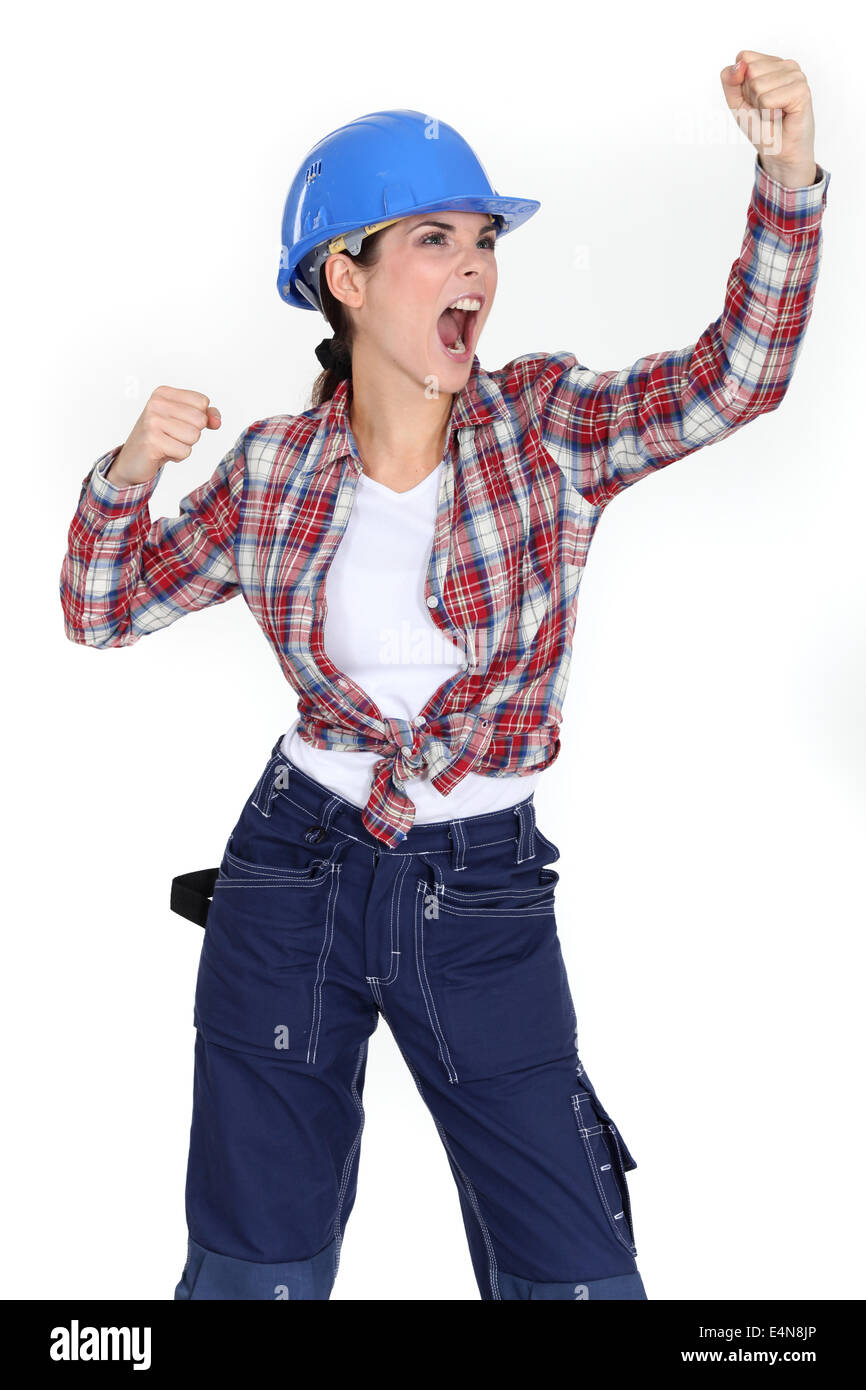 Female builder punching air Stock Photo - Alamy
