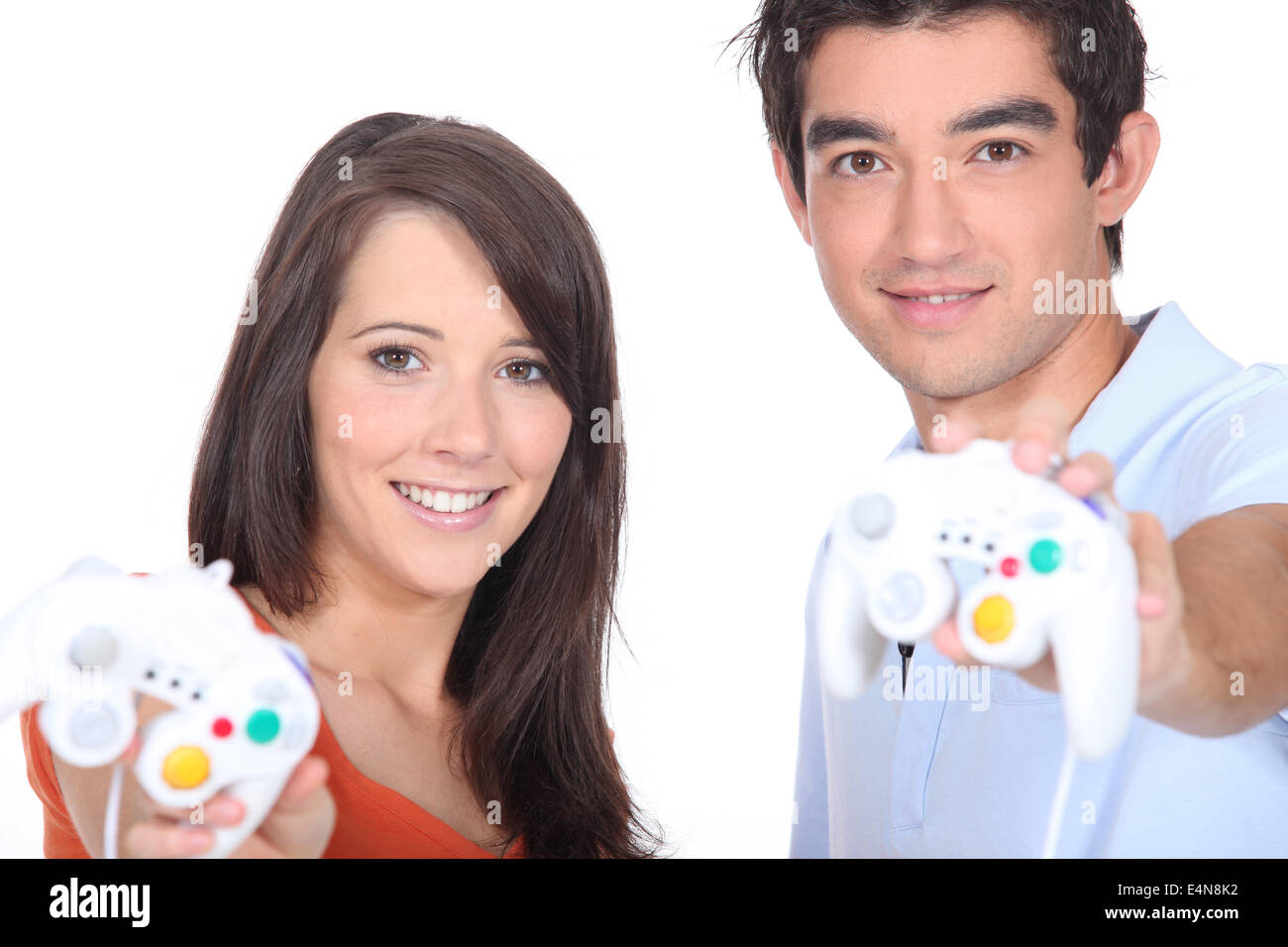 Young people with handsets for games console Stock Photo - Alamy