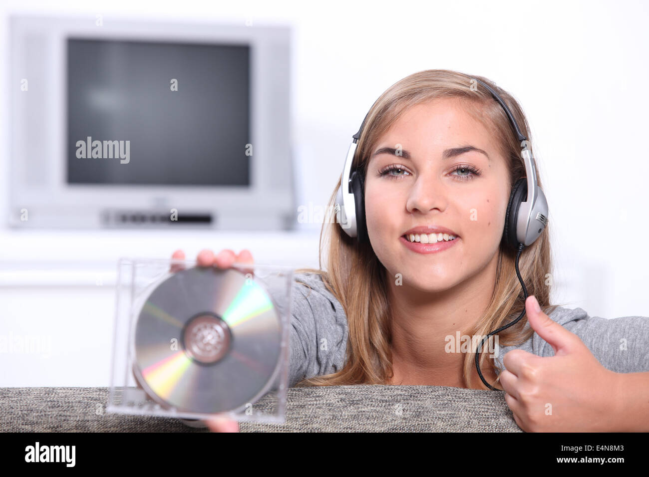 Young woman holding a CD Stock Photo - Alamy