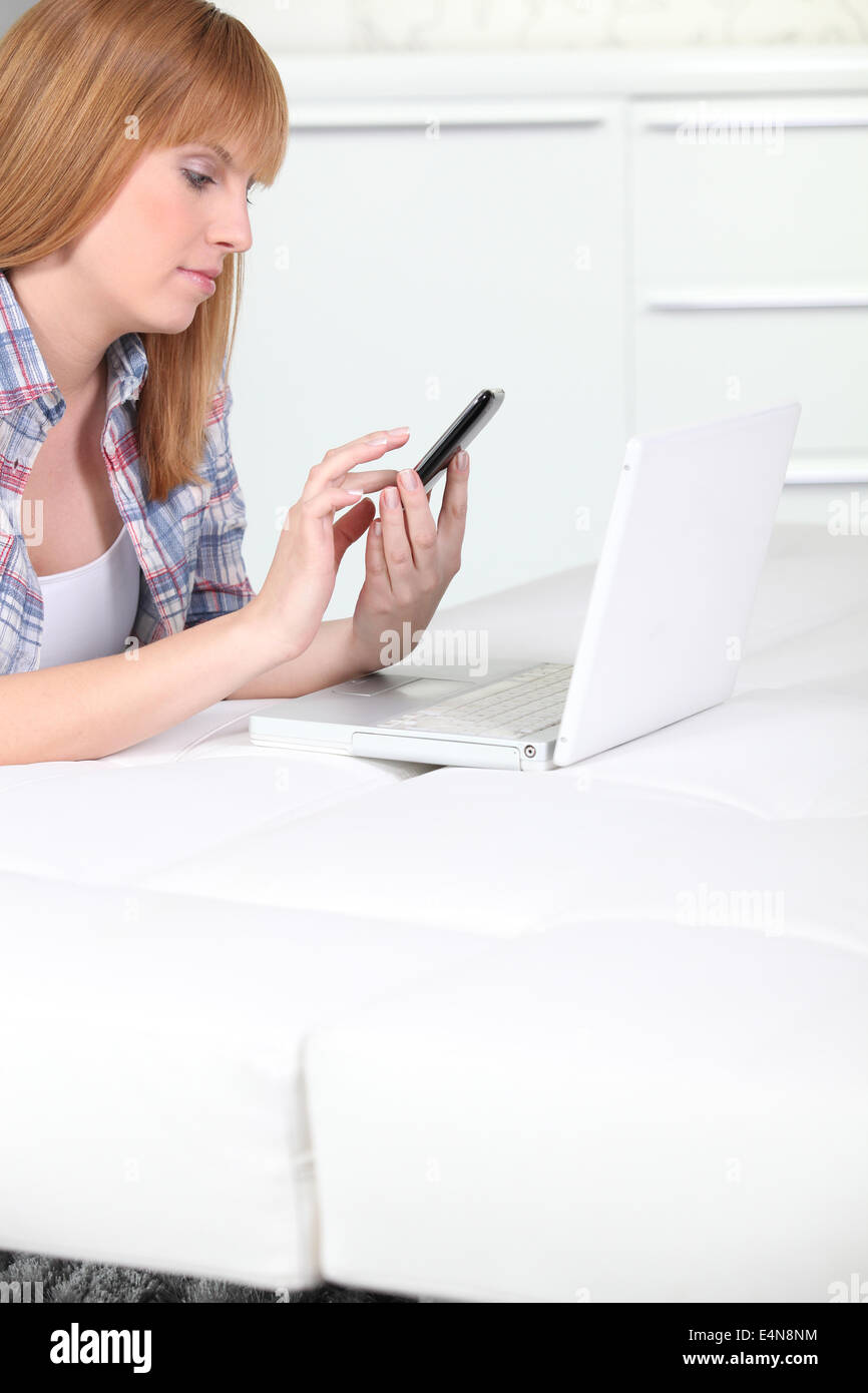 Woman sending message with mobile telephone Stock Photo - Alamy