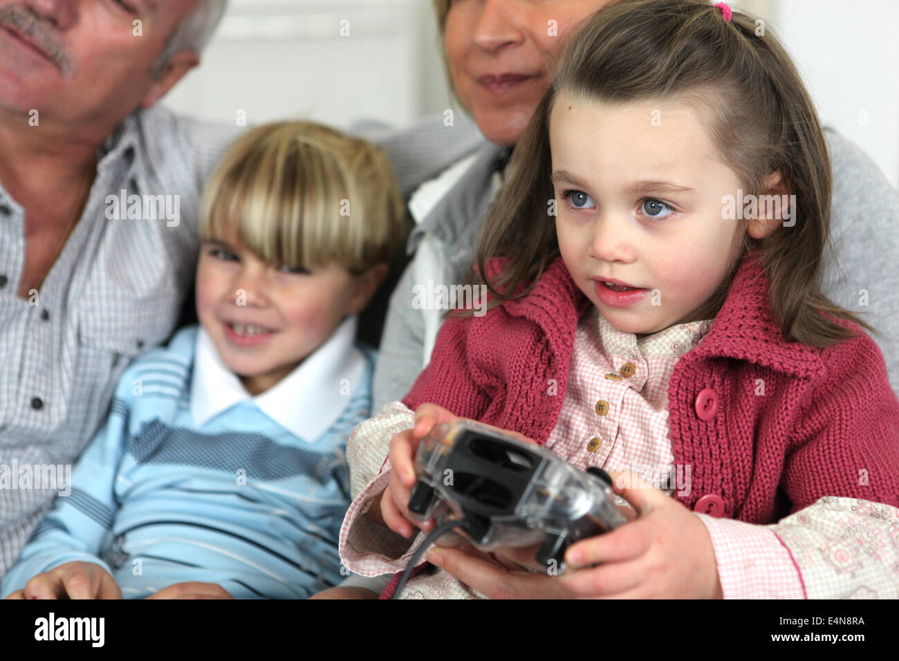 family playing video games Stock Photo - Alamy