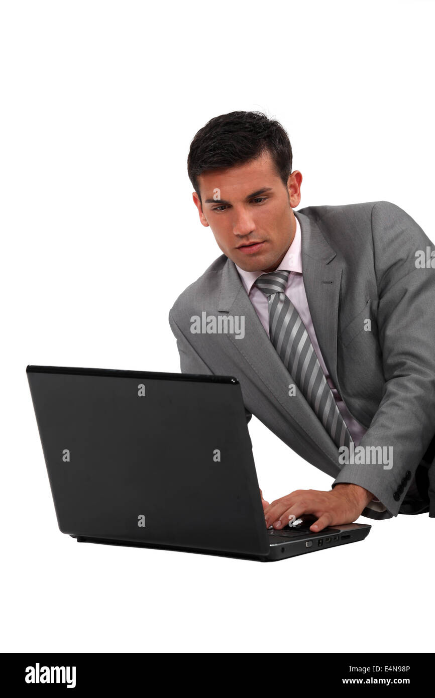 Elegant man with a computer Stock Photo - Alamy