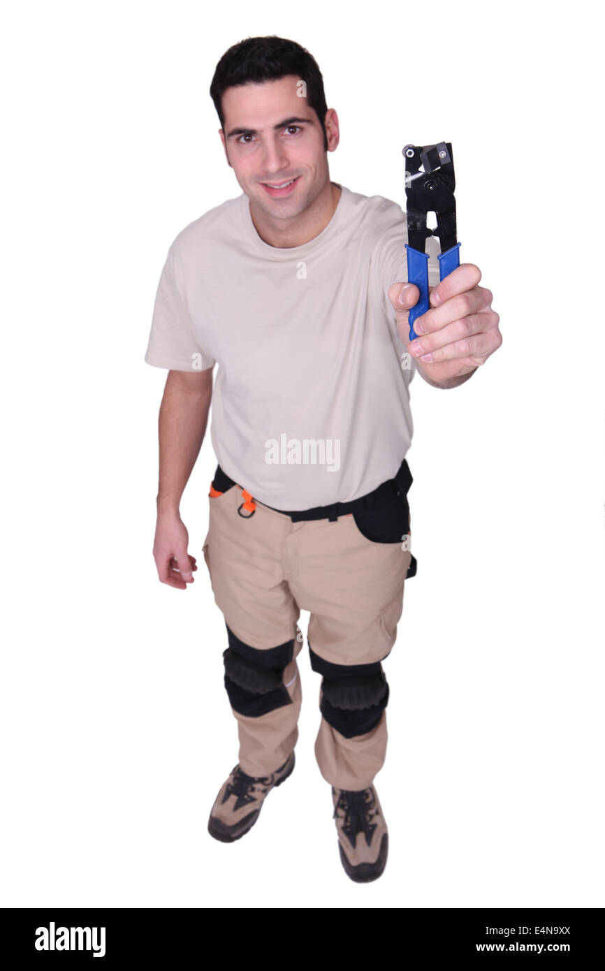 Man holding pliers Stock Photo - Alamy