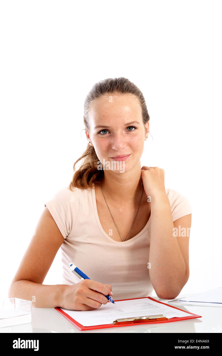 Young woman sitting writing Stock Photo - Alamy