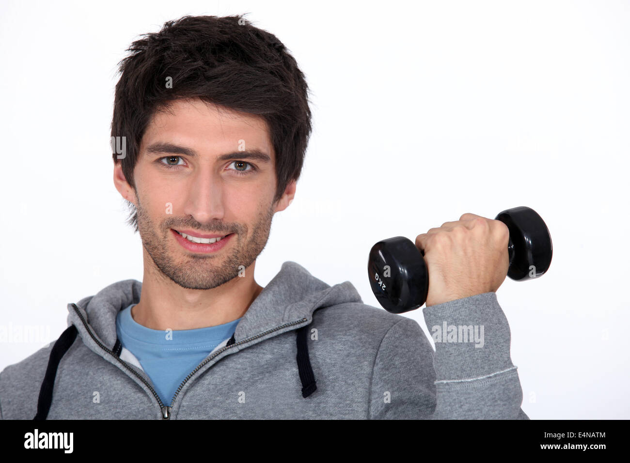 Man lifting a dumbbell Stock Photo - Alamy