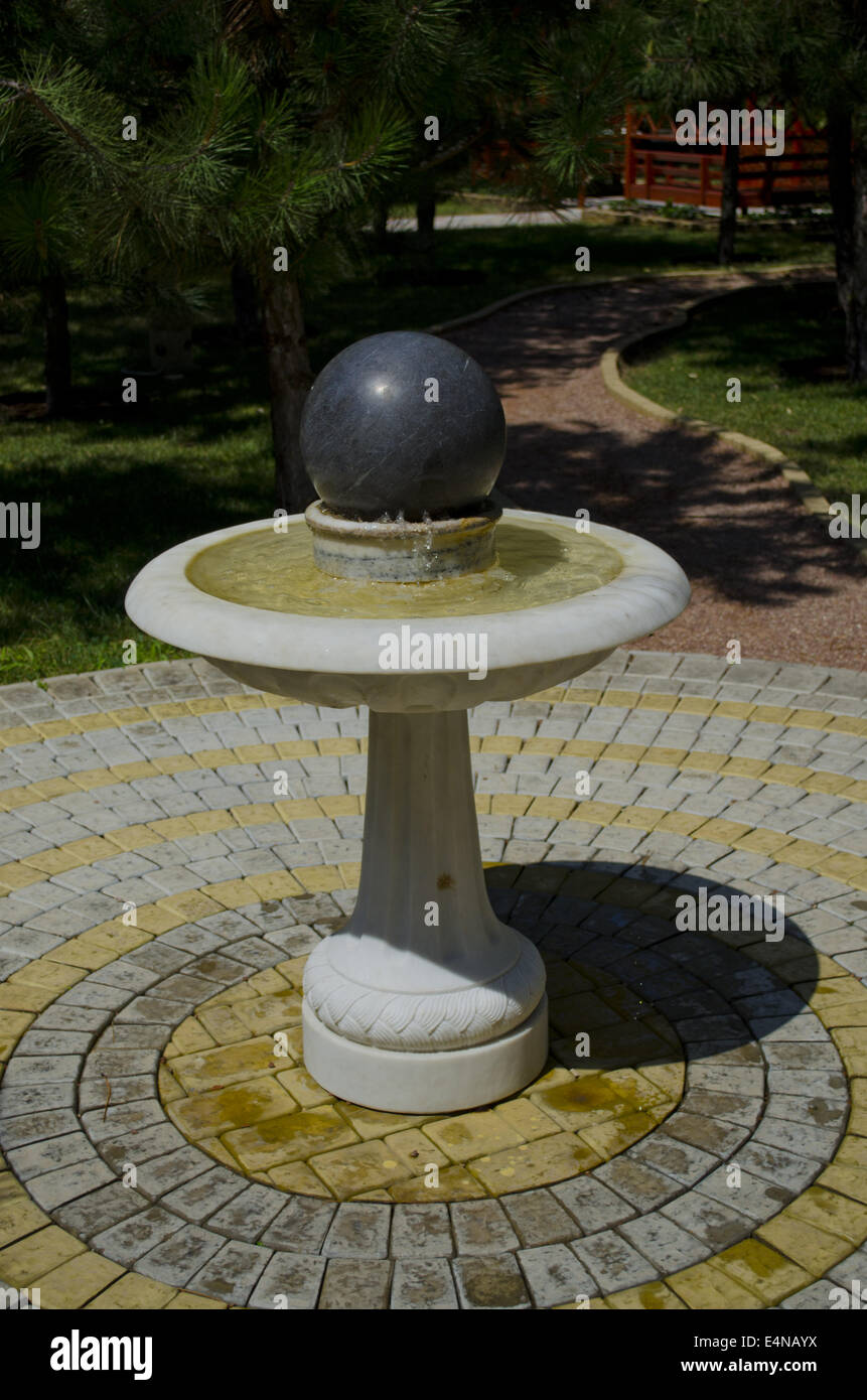 One sphere on pedestals Stock Photo - Alamy