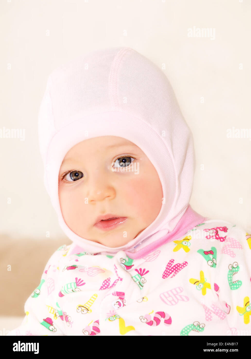 Baby girl, wearing a hood Stock Photo - Alamy