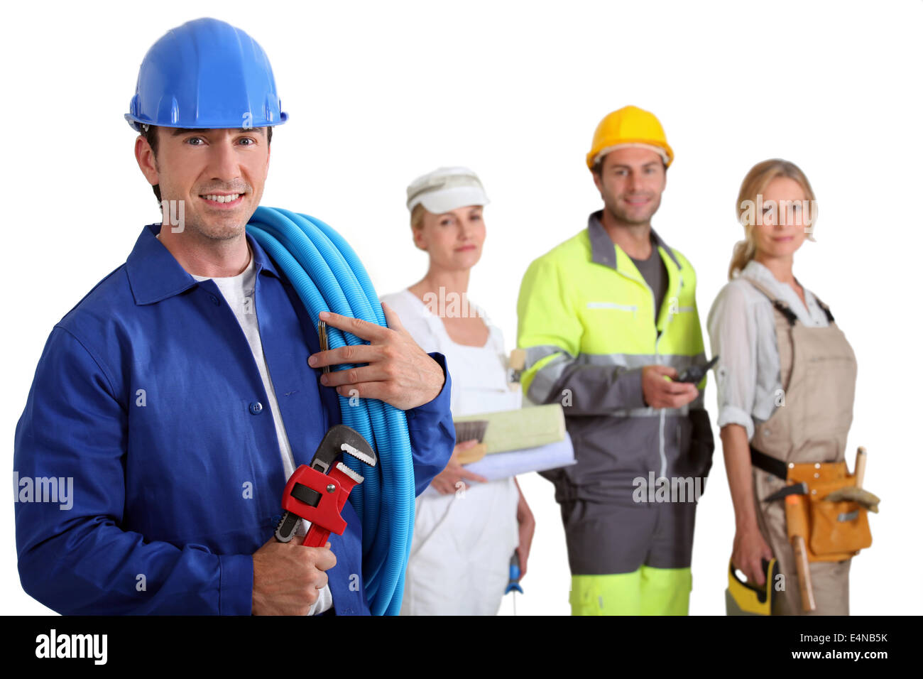 Various workers stood in row Stock Photo - Alamy