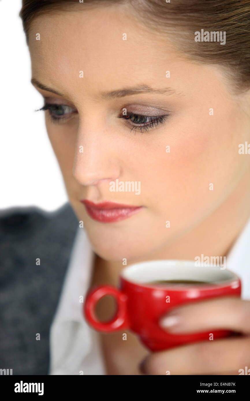 Woman holing cup of espresso Stock Photo - Alamy