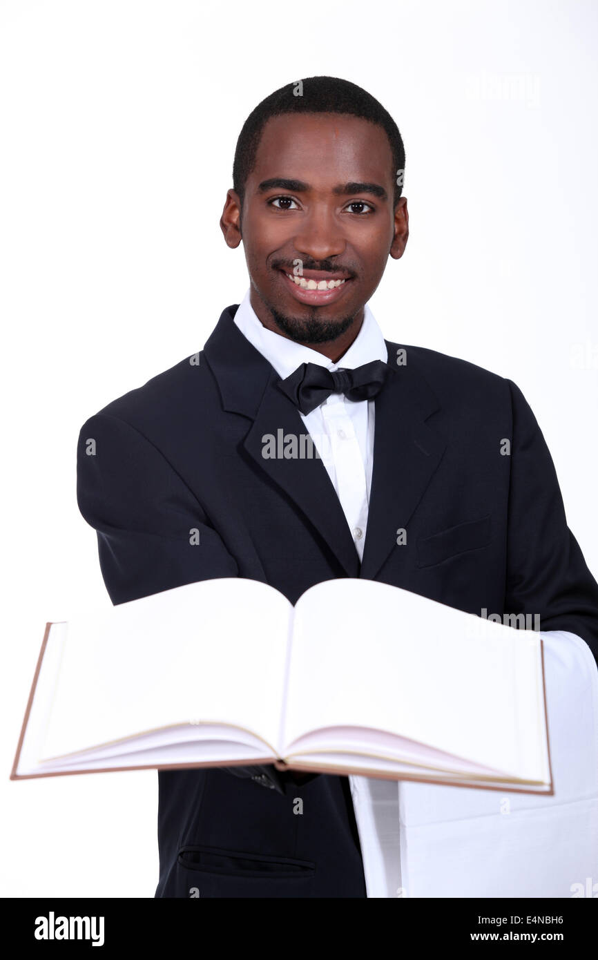 black man presenting a book Stock Photo - Alamy black man presenting a book Stock Photo - Alamy
