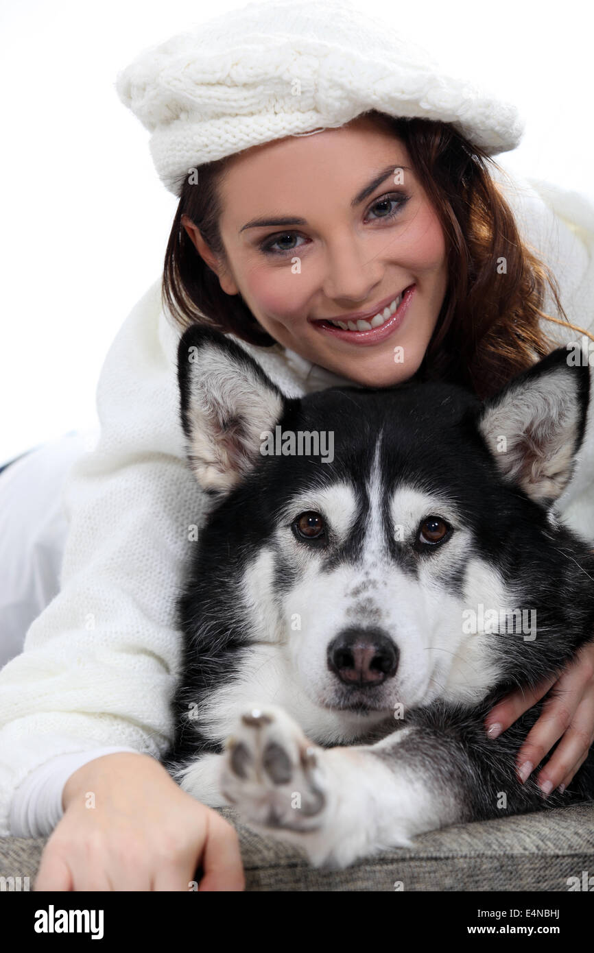 Portrait of a woman with her husky dog Stock Photo - Alamy