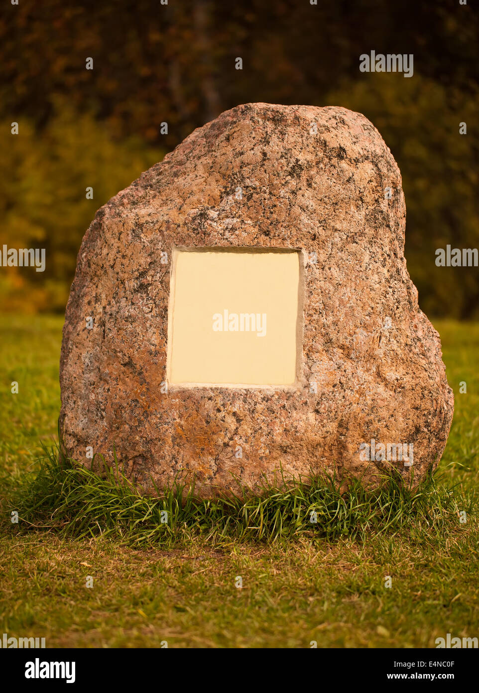 Big granite rock with empty metal plate Stock Photo - Alamy