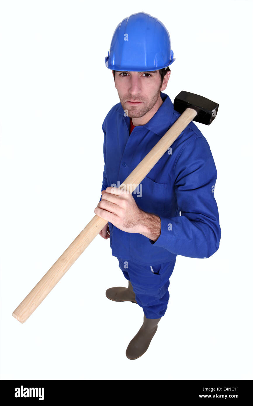 Craftsman with hammer on shoulder Stock Photo - Alamy