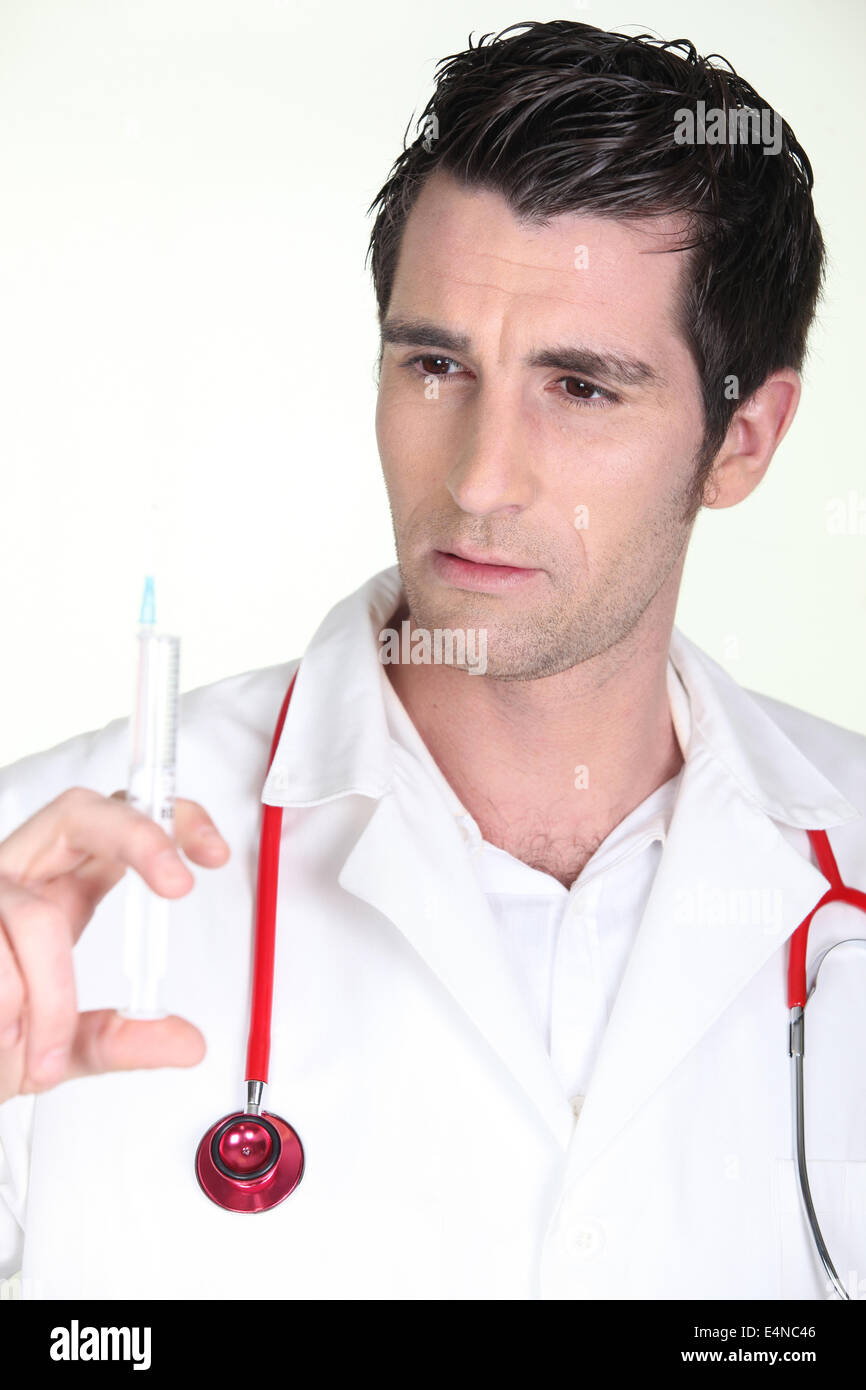 Man with syringe Stock Photo - Alamy