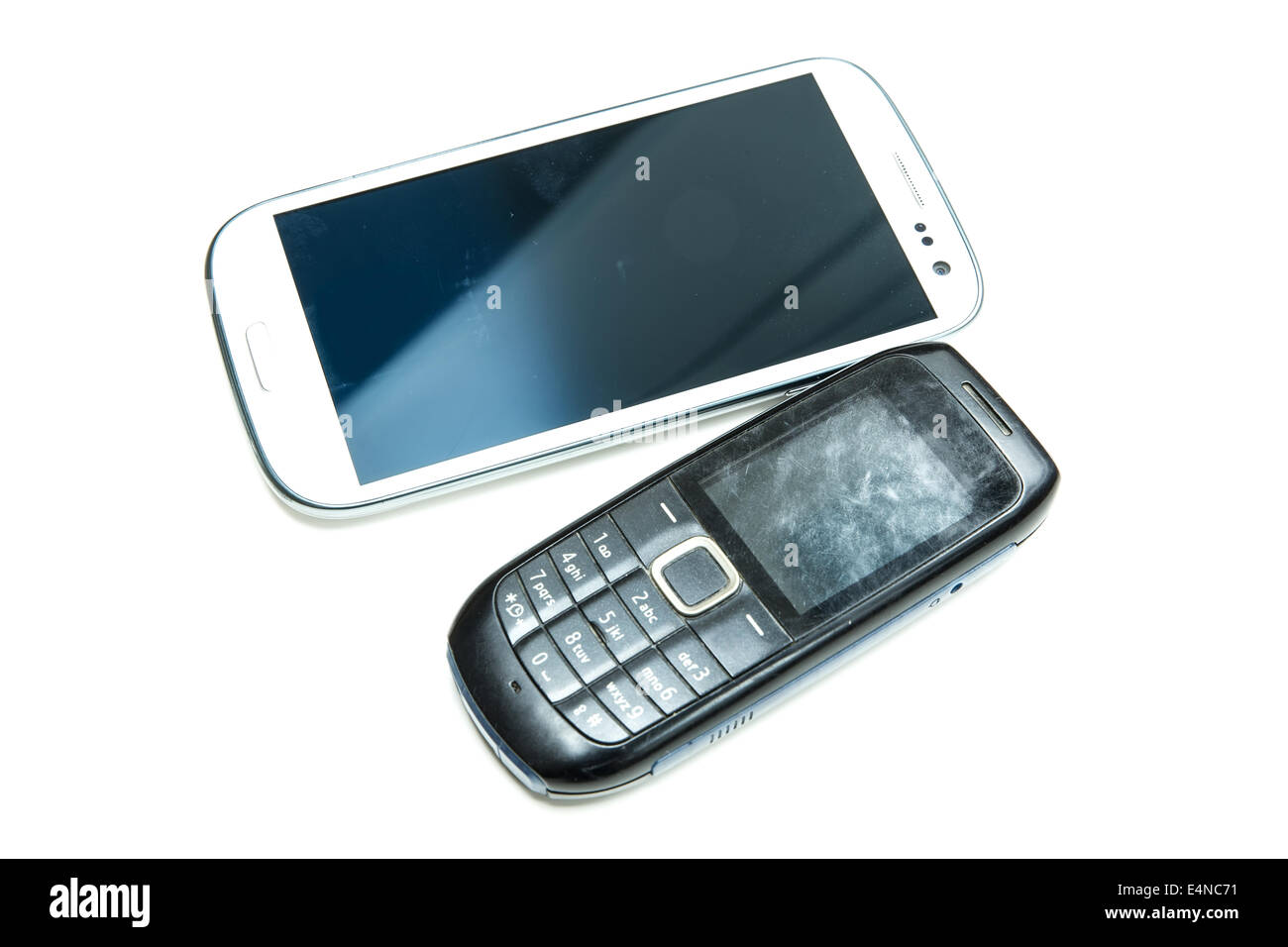 A modern smartphone and a old classic cell phone side by side Stock ...